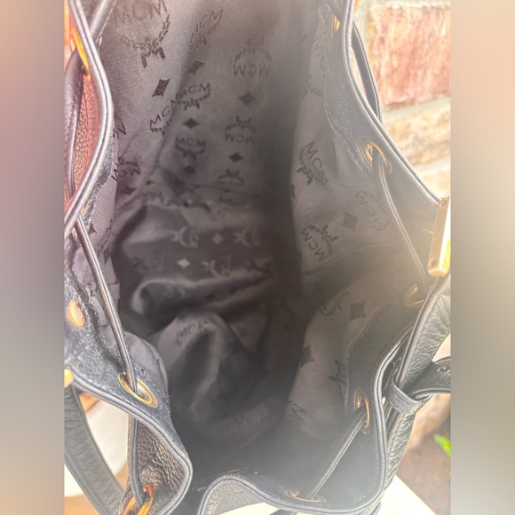 MCM | Bags | Mcm Black Leather Drawstring Bucket Bag Visetos Logo Gold ...
